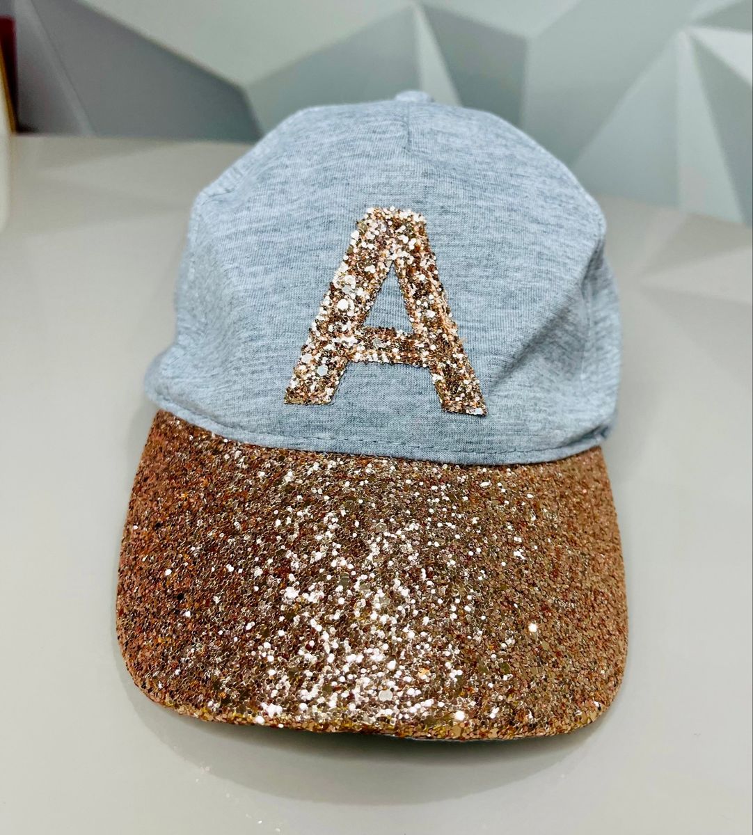 Boné Cinza com a Letra a Marca Justice 84668487 | enjoei